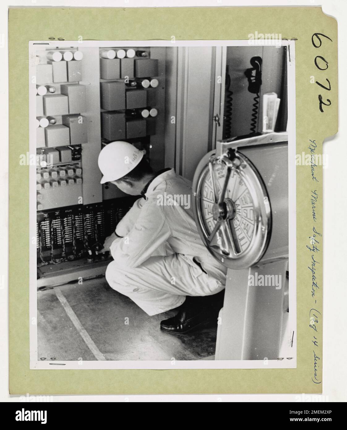 Coast Guard Lieutenant Joel D. Sipes inspects the wiring on the SS ...
