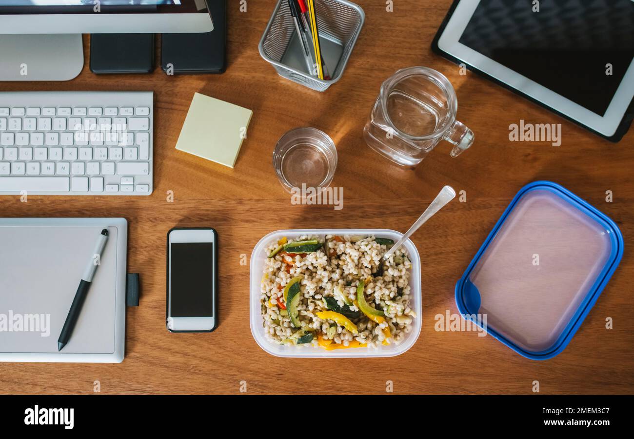 Barley salad lunchbox on a desk at office, vegetarian food Stock Photo ...