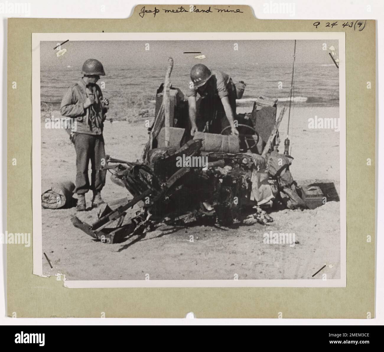 An American jeep strikes a land mine on the beach during the invasion ...