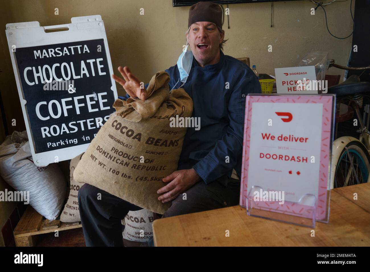 Jeffray Gardner, the owner of Marsatta Chocolate poses with a bag of ...