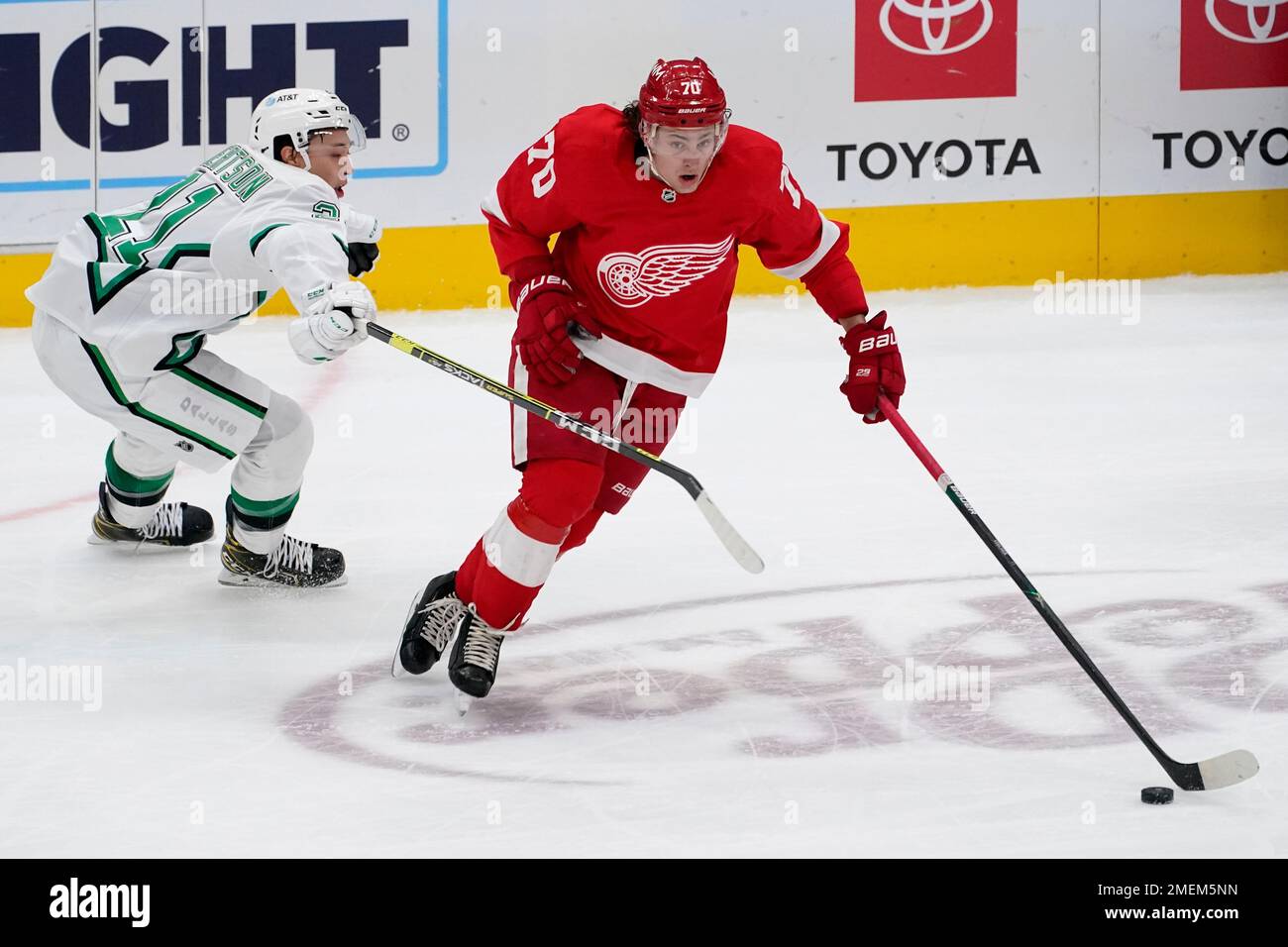 Dallas Stars left wing Jason Robertson (21) reaches in as Detroit Red ...