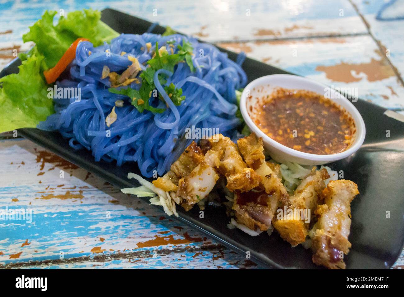 Purple Butterfly Pea Noodles with Crispy Pork in Chiang Mai, Thailand ...