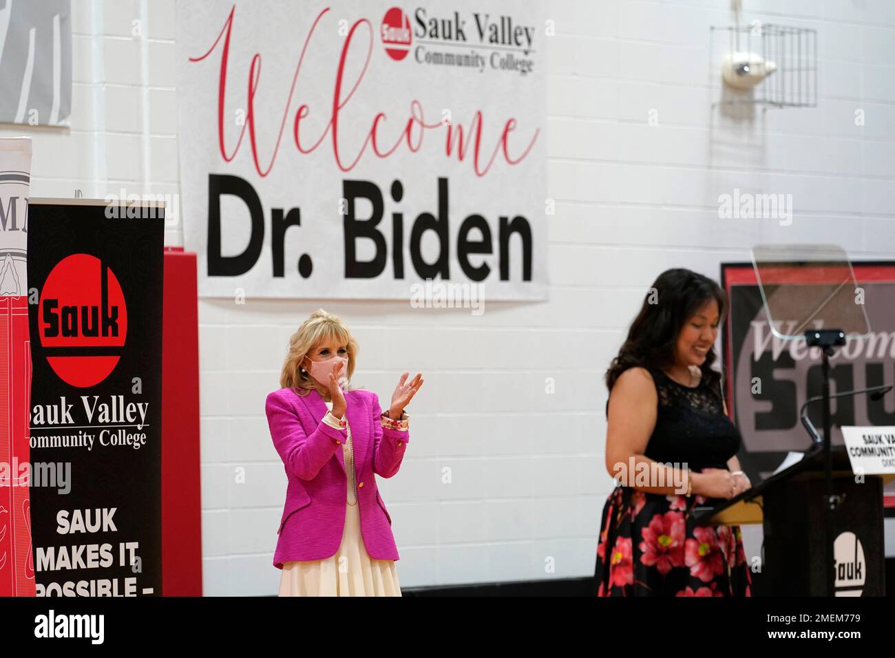First lady Jill Biden, left, applauds after being introduced to speak ...
