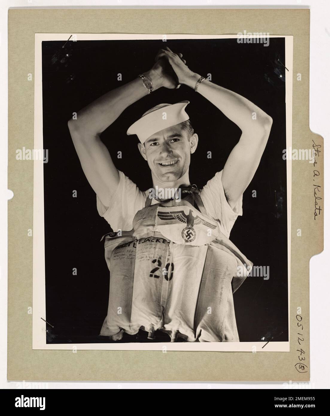 Coast Guardsman Steve M. Kalata shows two trophies from his ship, the U ...