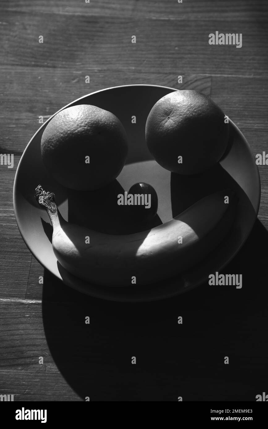 Fruits on plate wooden Black and White Stock Photos & Images - Alamy
