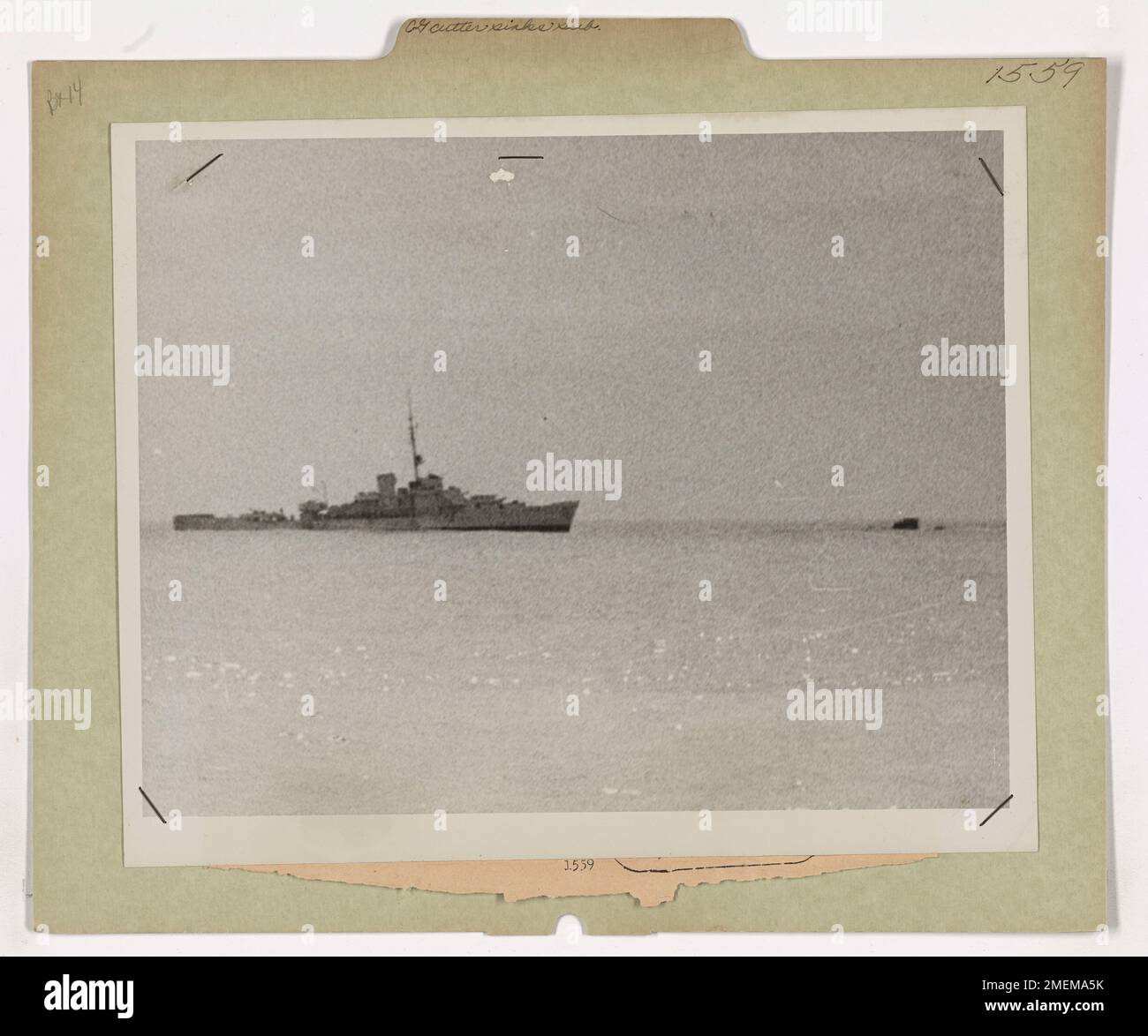 A U.S. Coast Guard cutter engages a German submarine during World War ...