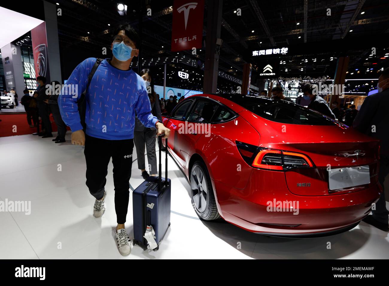 Visitors To The Tesla Booth Look At Cars On Display During The Shanghai