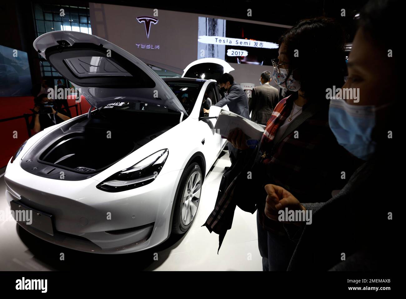 Visitors To The Tesla Booth Look At Cars On Display During The Shanghai