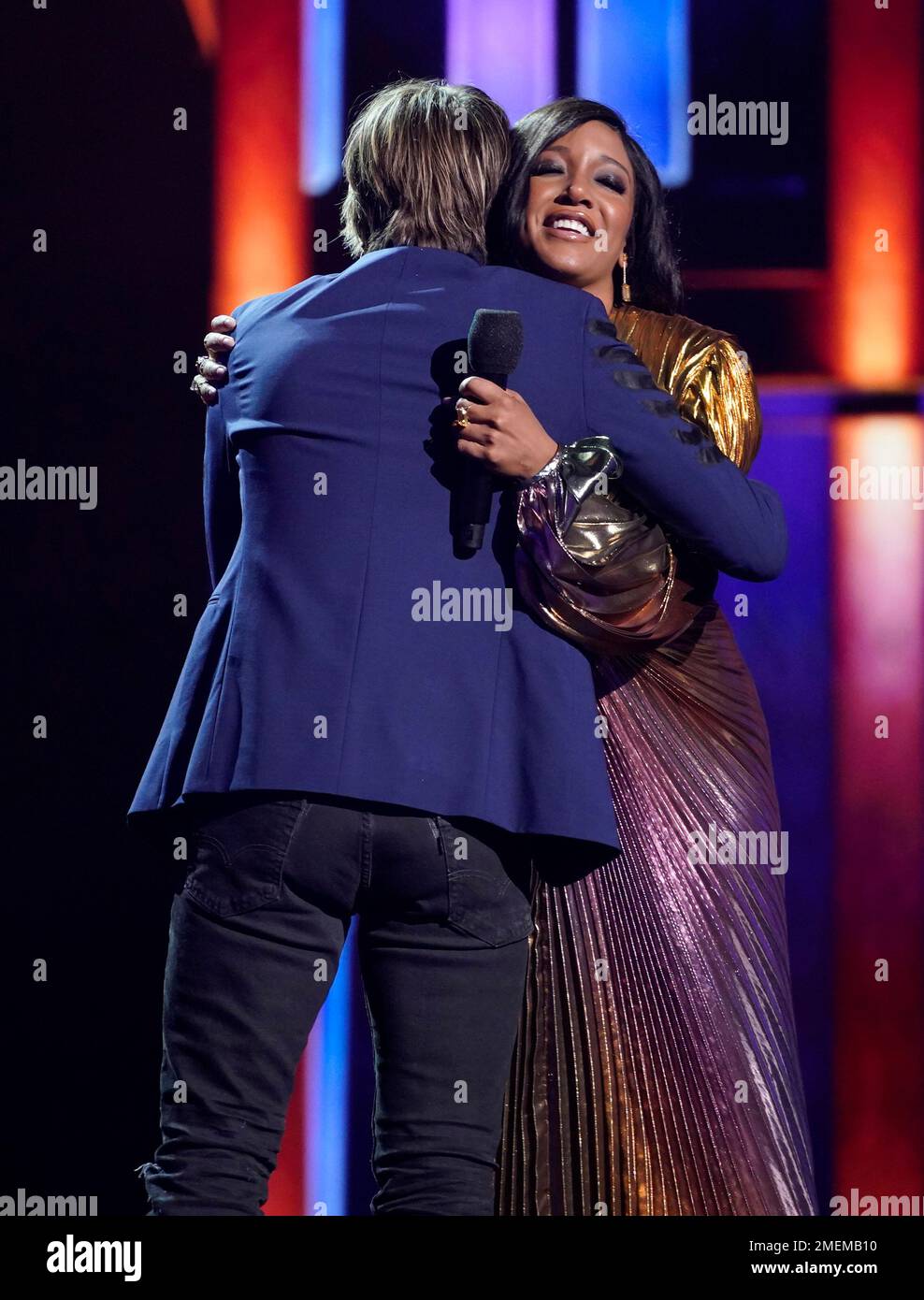 Hosts Keith Urban, left, and Mickey Guyton speak at the 56th annual ...