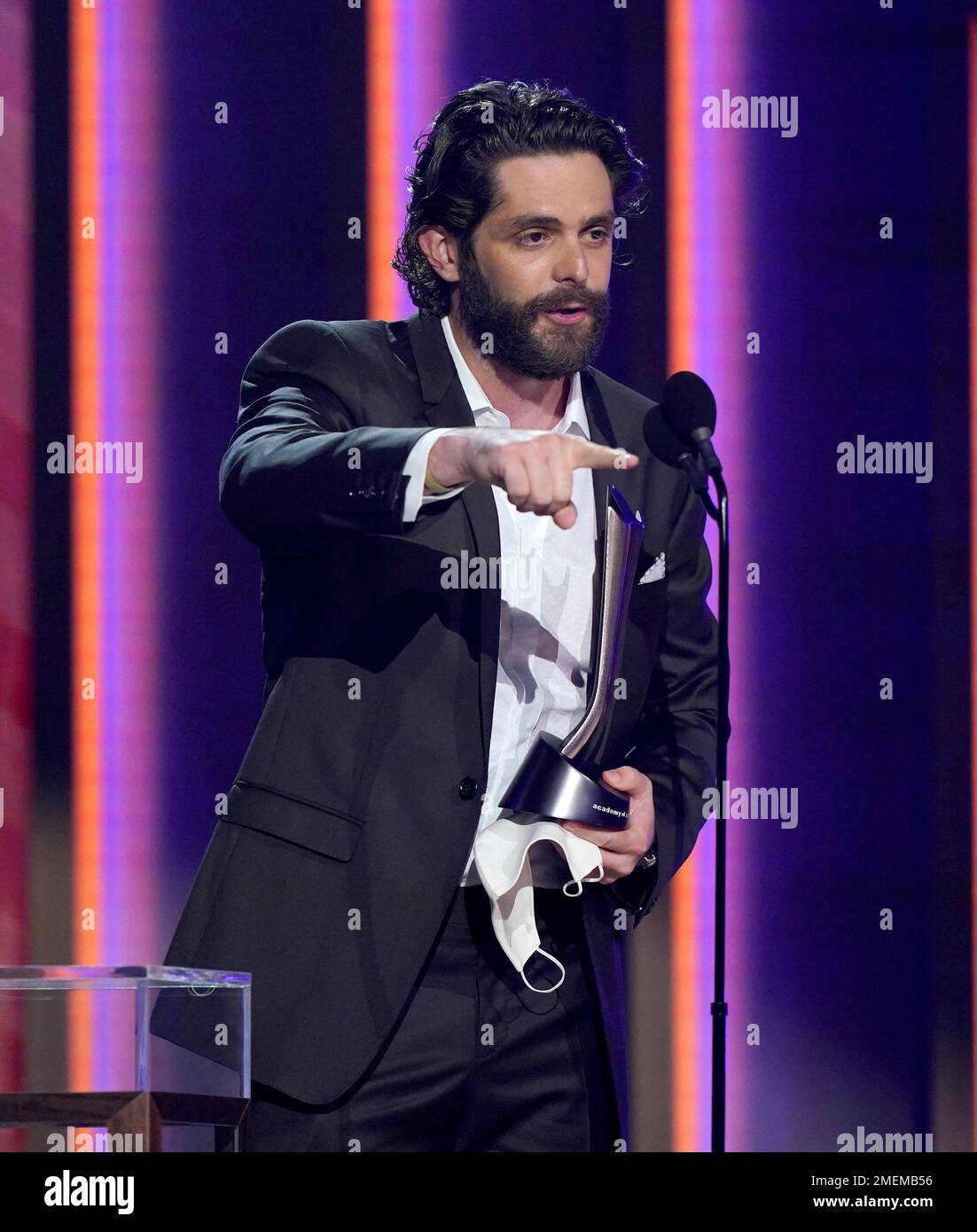 Thomas Rhett accepts the award for male artist of the year at the 56th ...