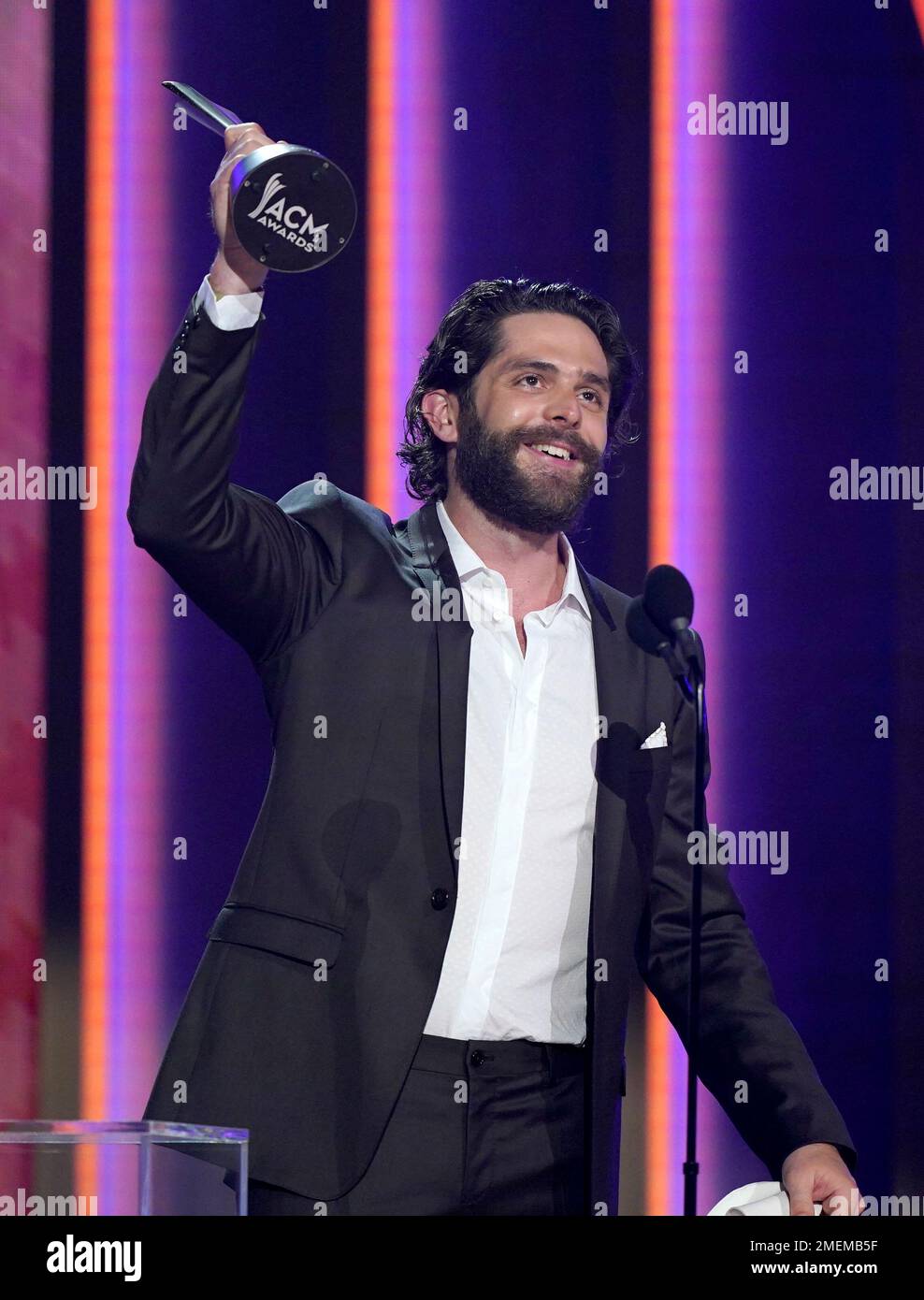 Thomas Rhett accepts the award for male artist of the year at the 56th ...
