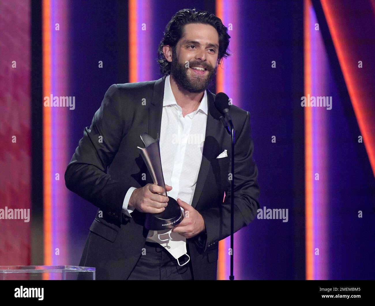 Thomas Rhett accepts the award for male artist of the year at the 56th ...