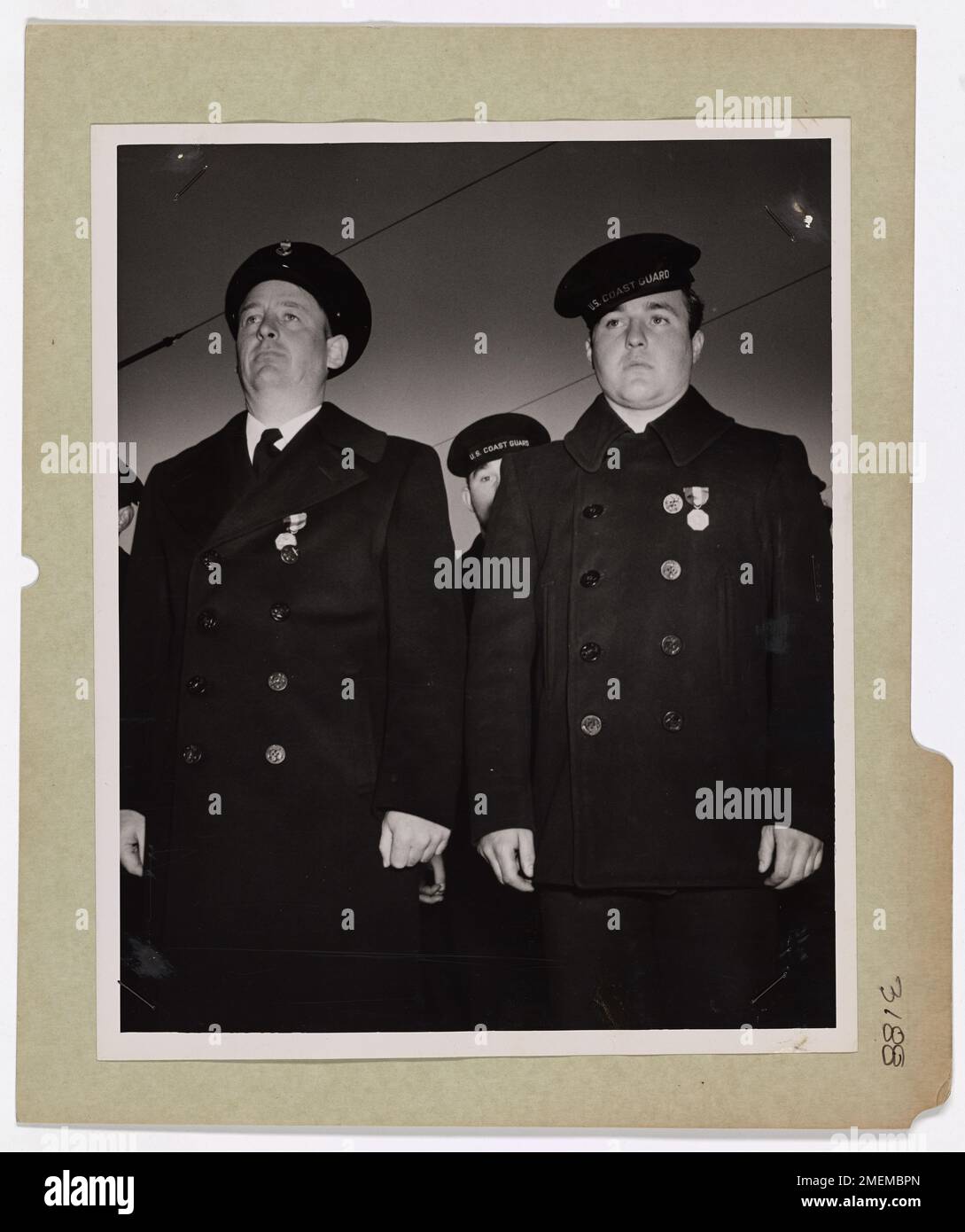 This image shows a group of Coast Guardsmen engaged in their daily ...