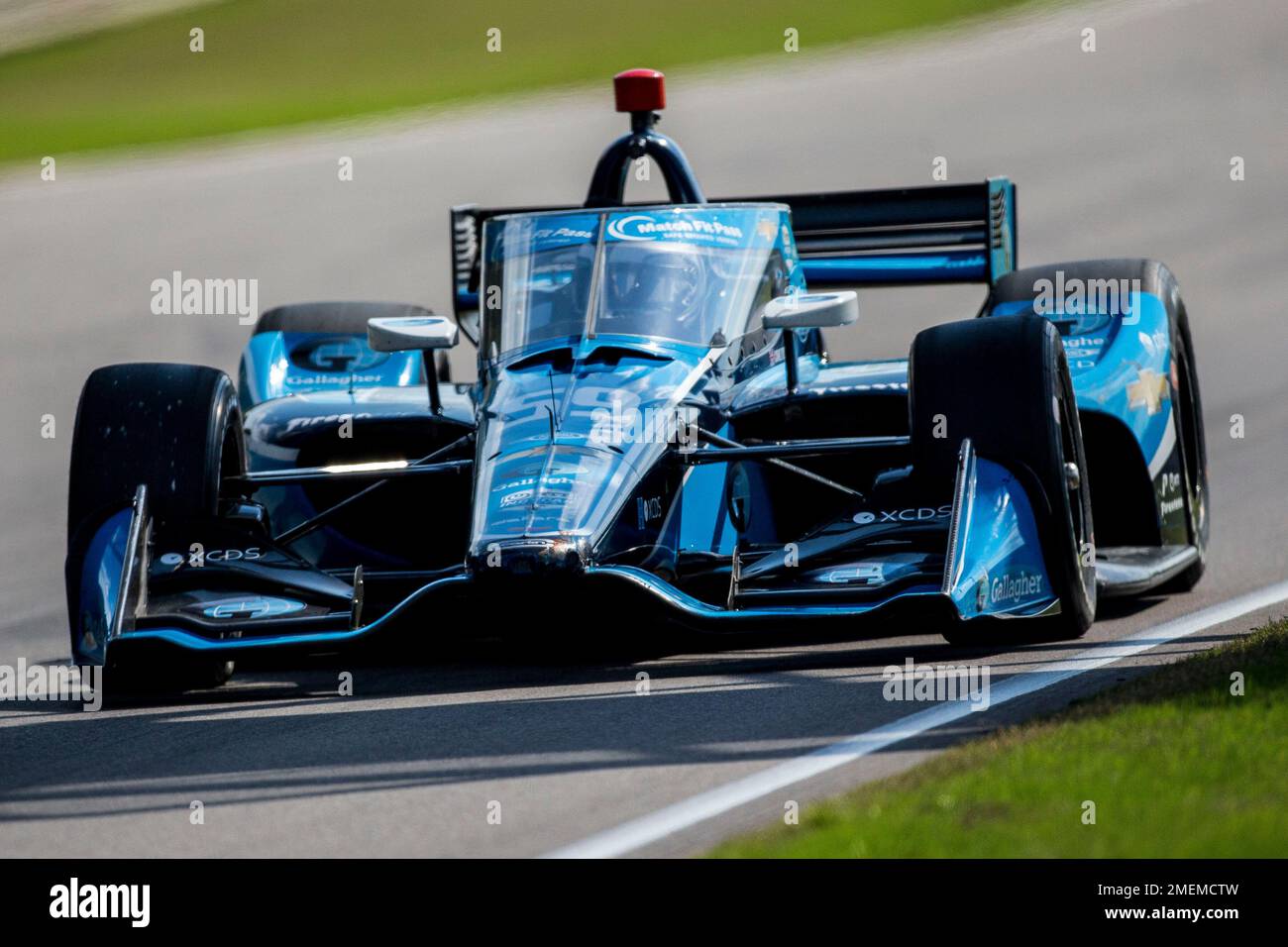 Carlin driver Max Chilton (59) takes the straightaway after Turn 7 ...