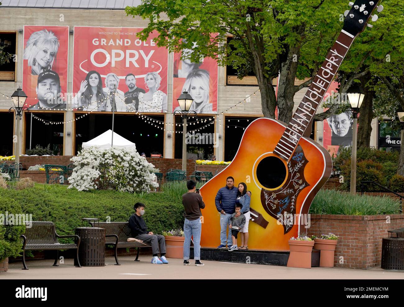People take photos in front of a guitar before the start of the 56th ...