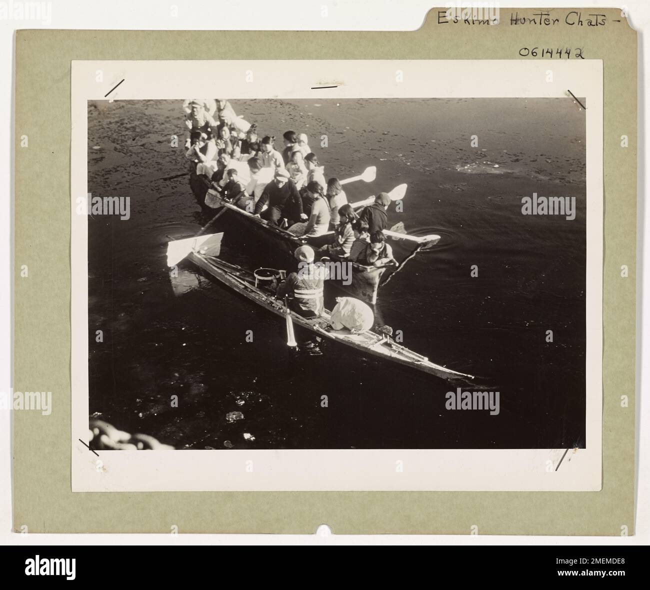 Eskimo Hunter Chats With the Women Folk. In his Kayak an Eskimo hunter ...