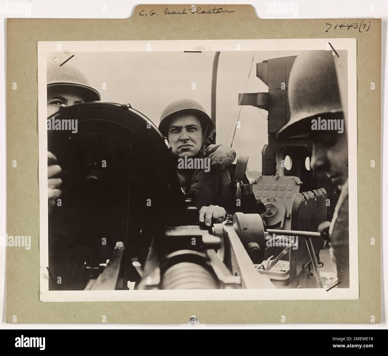 Coast Guardsmen operate the gun of a Landing Craft Infantry (LCI ...