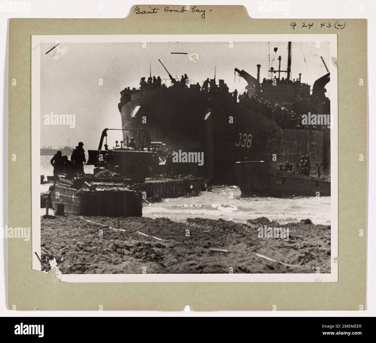 A Coast Guard-operated LST (Landing Ship, Tanks) opens its bow to ...