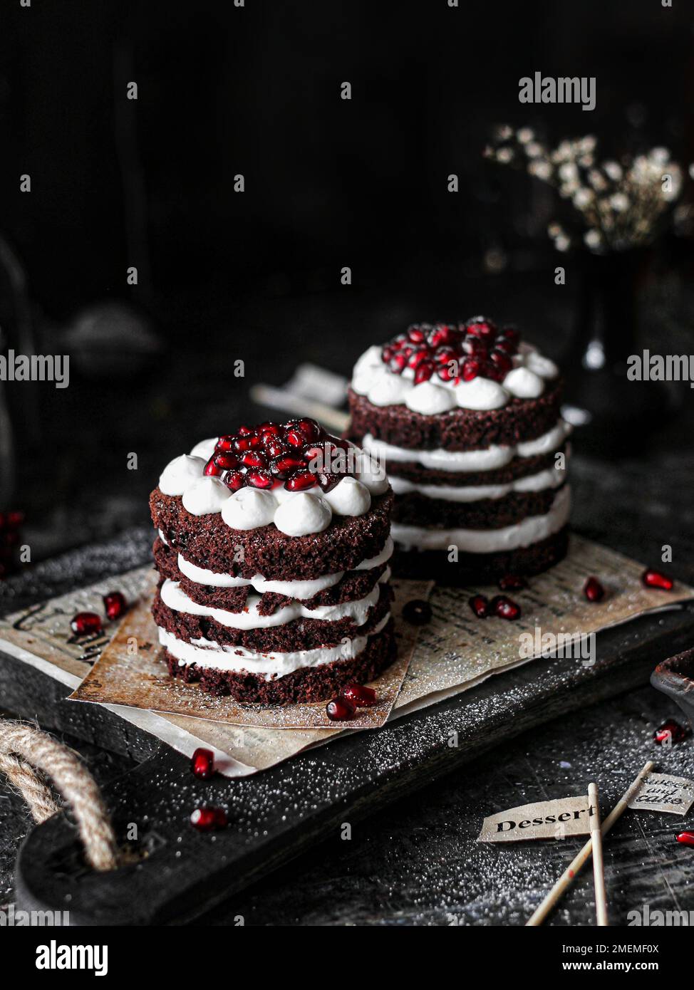 A small cake with pomegranates Stock Photo - Alamy