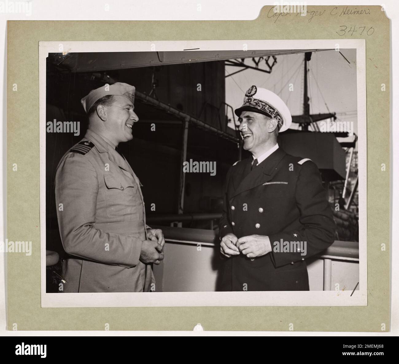 Coast Guard Captain Roger C. Heimer meets a Free French officer after ...