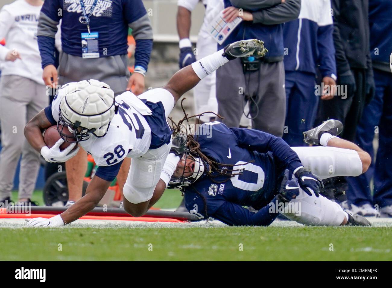 Penn State running back Devyn Ford (28) dives for more yardage past ...