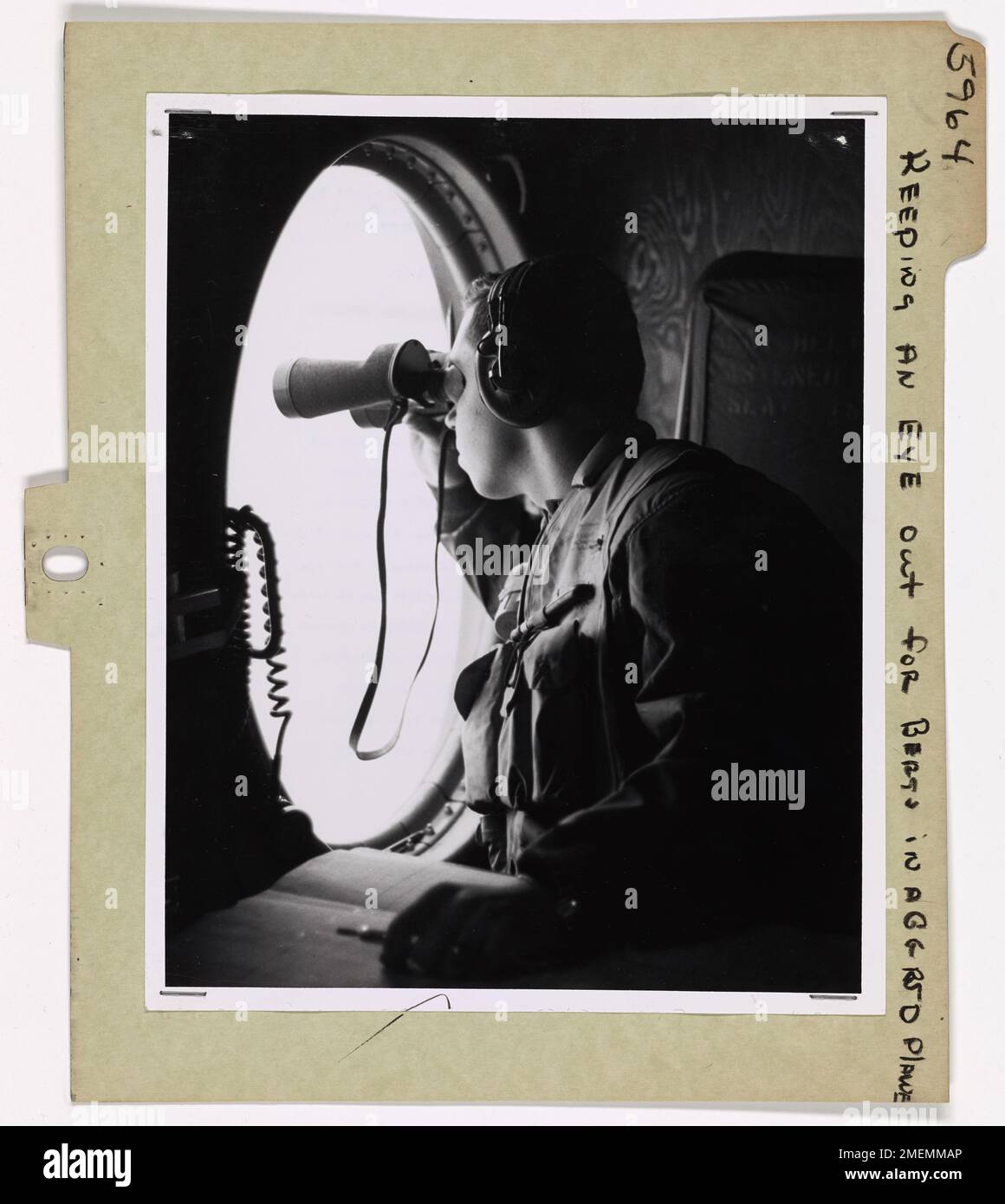 Ensign Kenneth C. Cutler, USCG, conducts an aerial search for icebergs ...