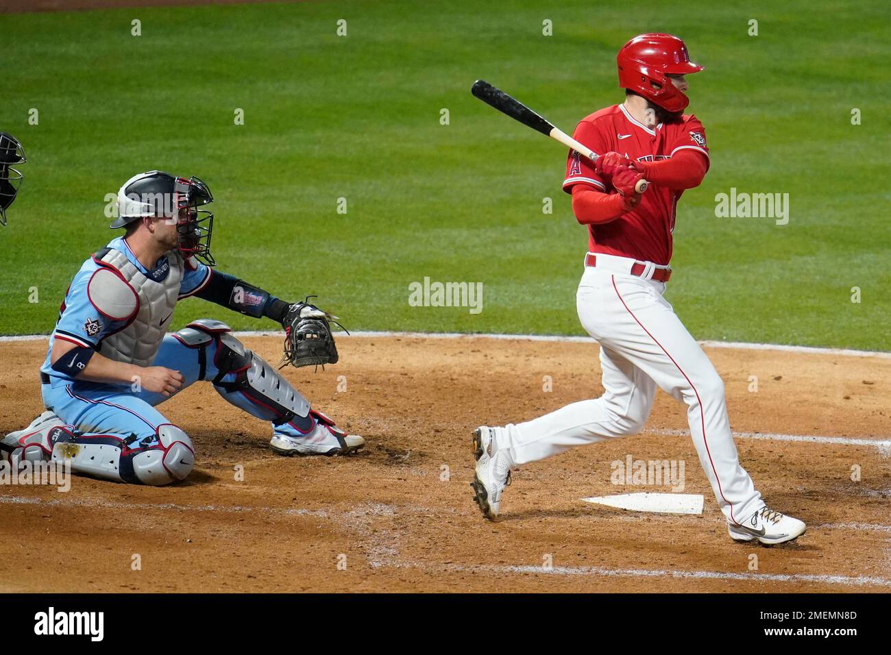 Los Angeles Angels' Jared Walsh, right, drives in two runs with a ...