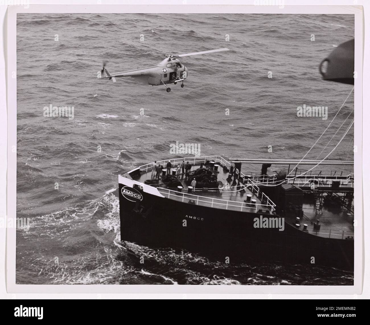 This image depicts a Coast Guard helicopter rescuing sailor Chester ...