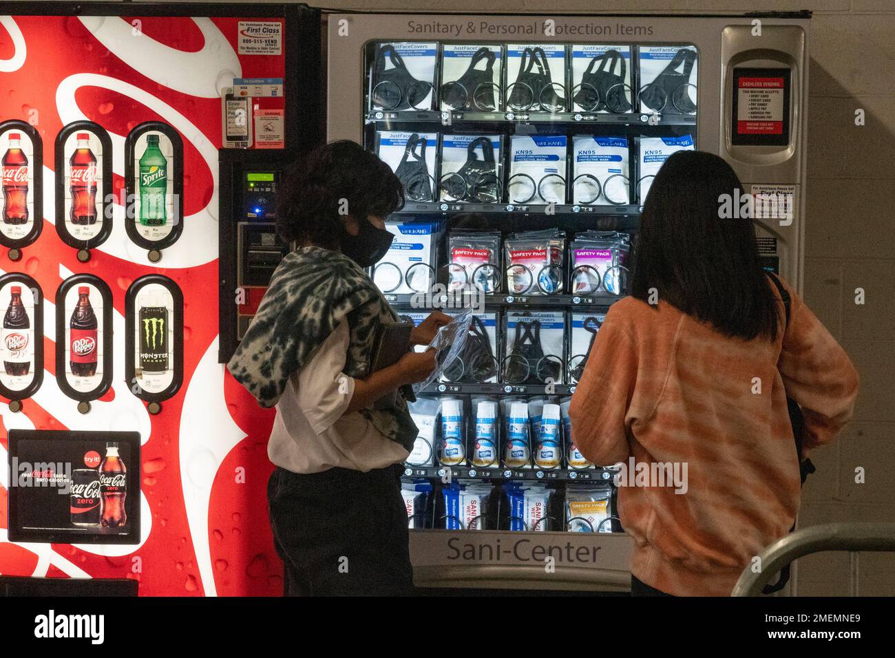 Visitors buy Personal Protection items from a Sani-Center vending ...
