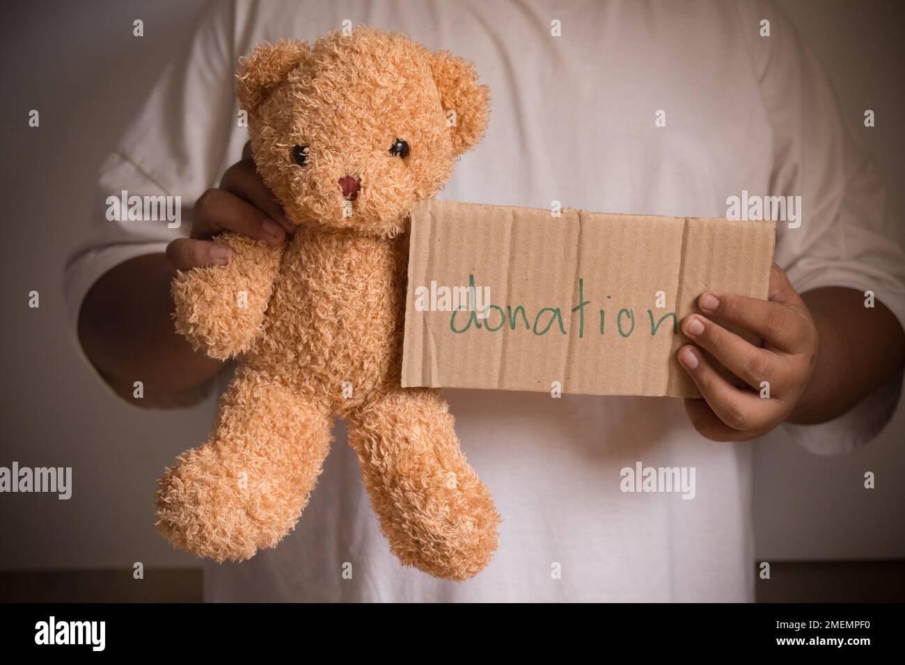 Hand holding teddy bear hi-res stock photography and images - Alamy