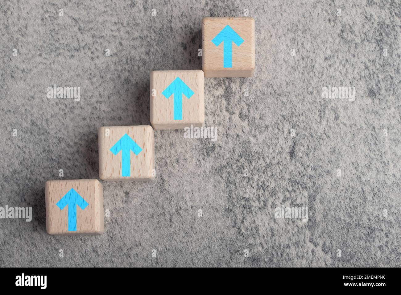 wooden blocks arranged stairs. concept curved line of arrow rising step ...