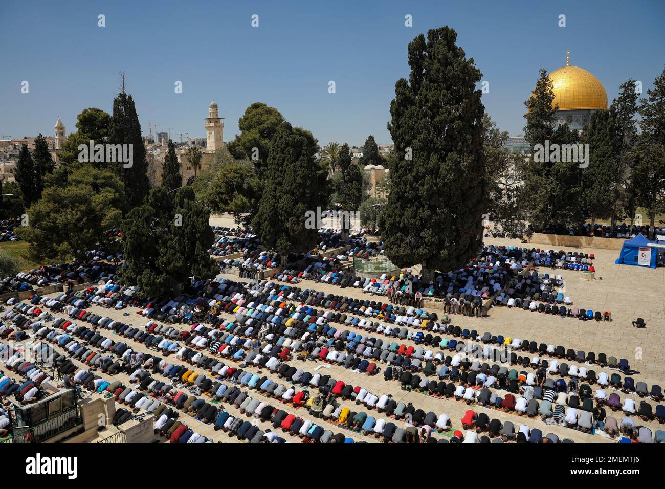 Palestinian worshipers pray during the first Friday of the holy month ...
