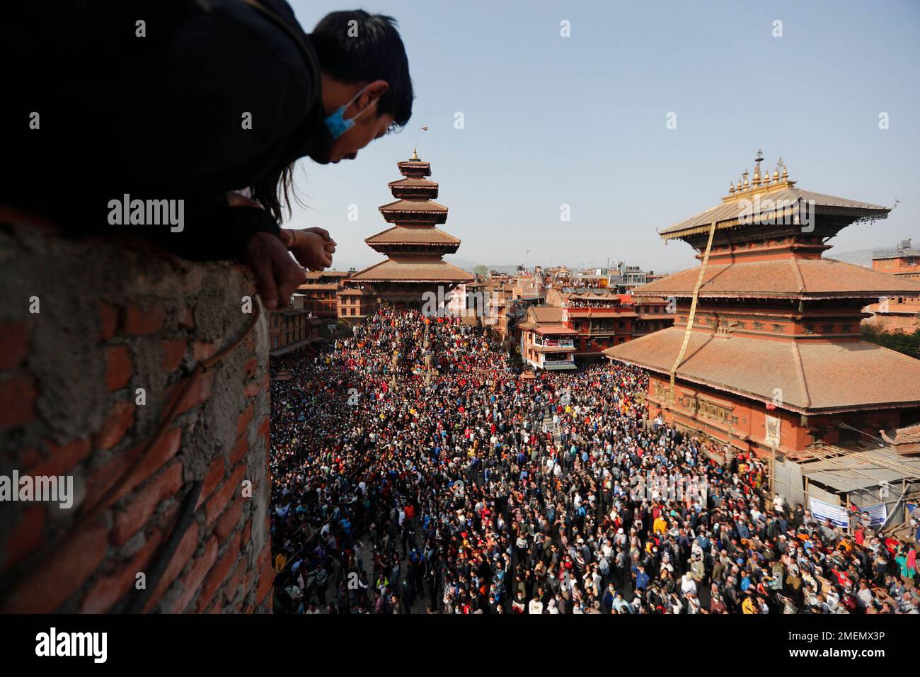 People watch devotees pulling a chariot in Biska Jatra Festival in ...