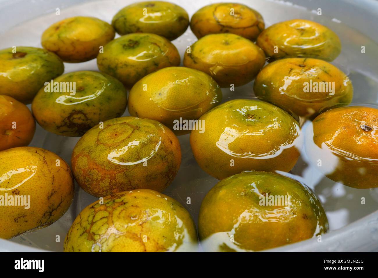 The orange sinking and washing in water Stock Photo - Alamy