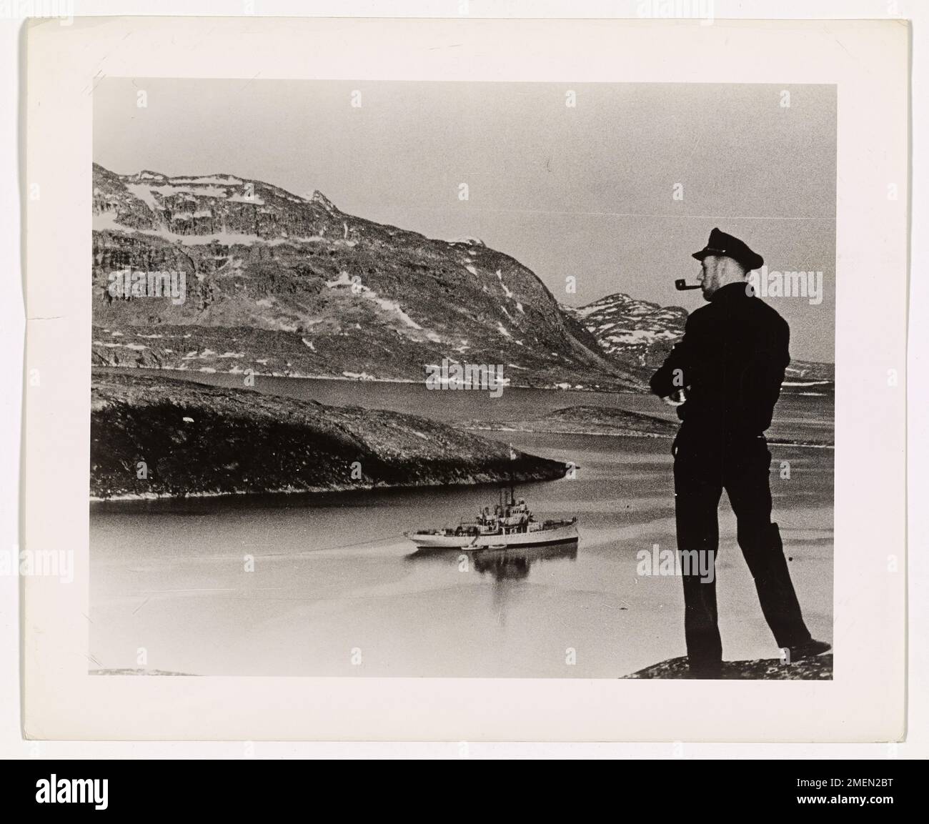 Photograph of Man smoking a pipe. This picture shows man smoking a pipe ...