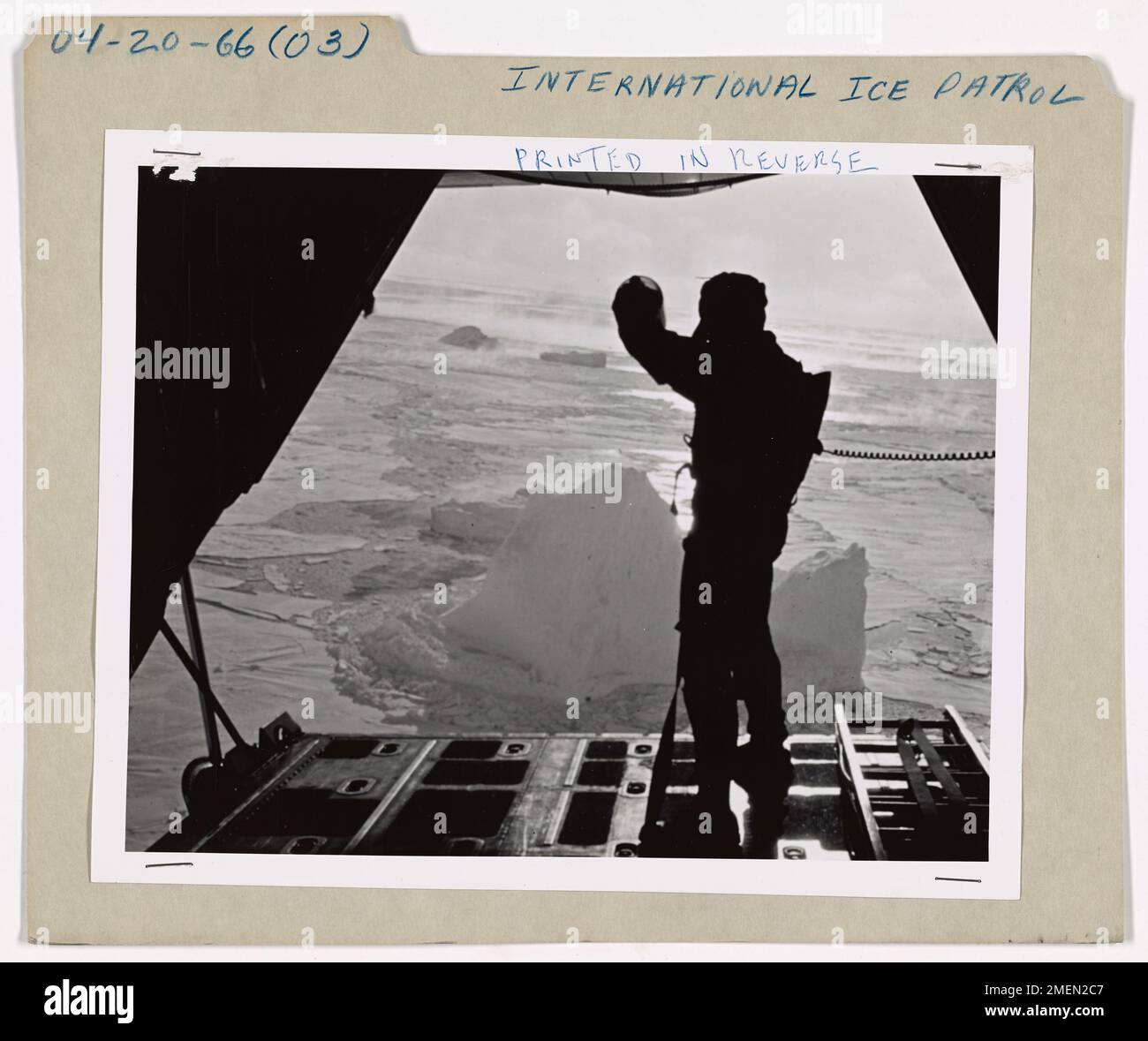 A U.S. Coast Guard HS-130-B Ice Patrol plane drops a dye bomb on an ...