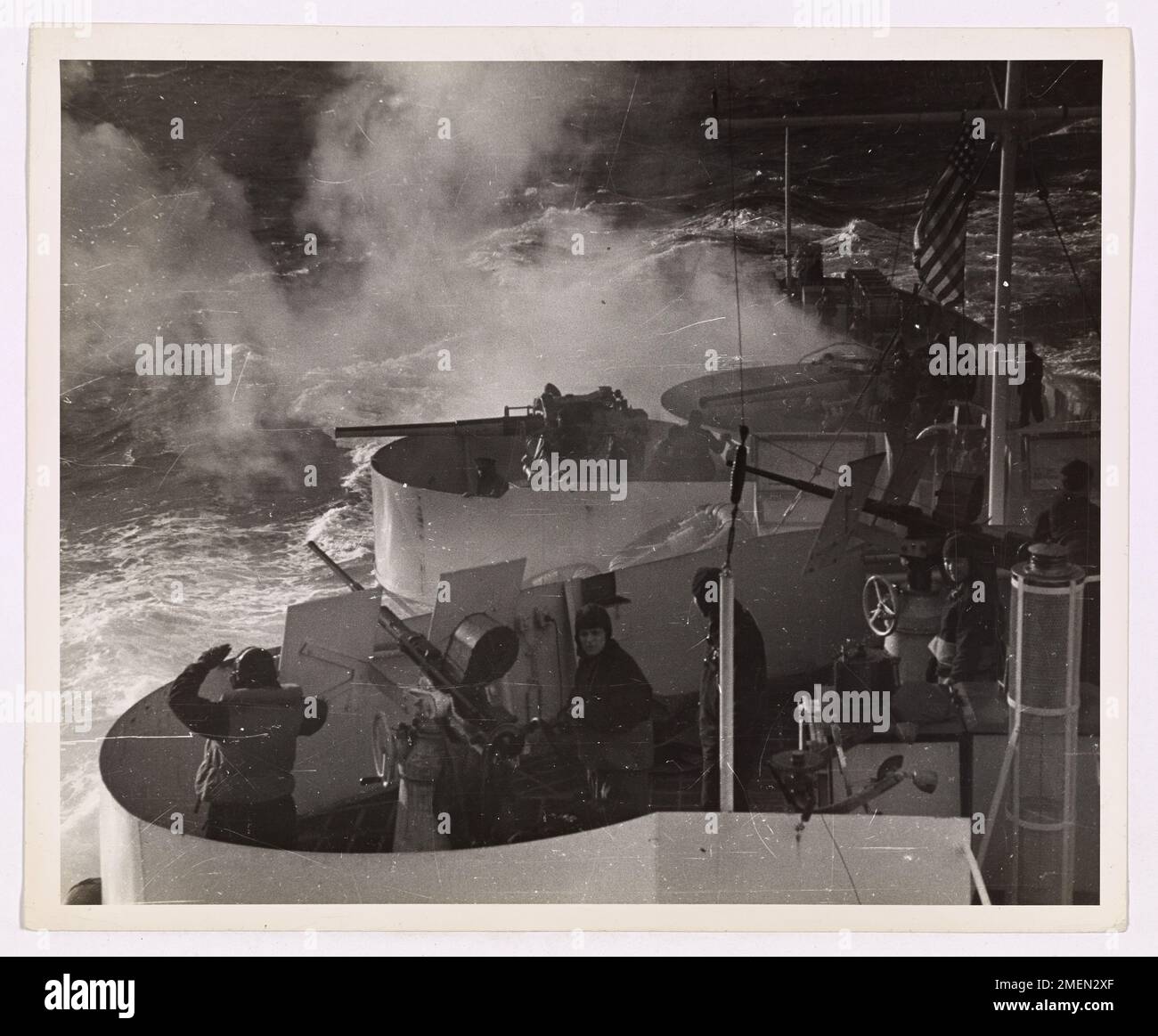 Coast Guardsmen are shown practicing at their battle stations aboard a ...