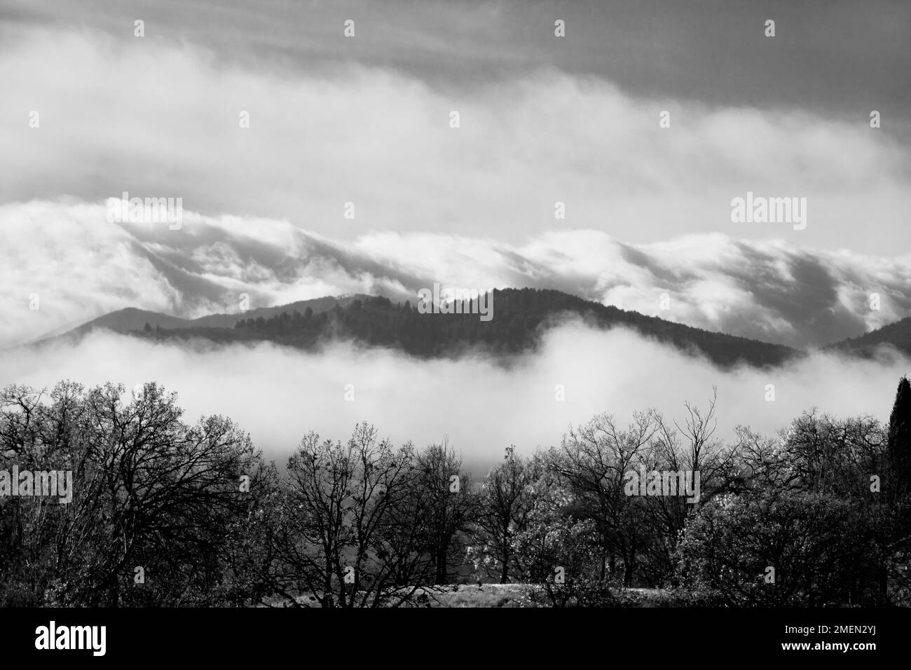 Misty mountain range shrouded in hi-res stock photography and images ...