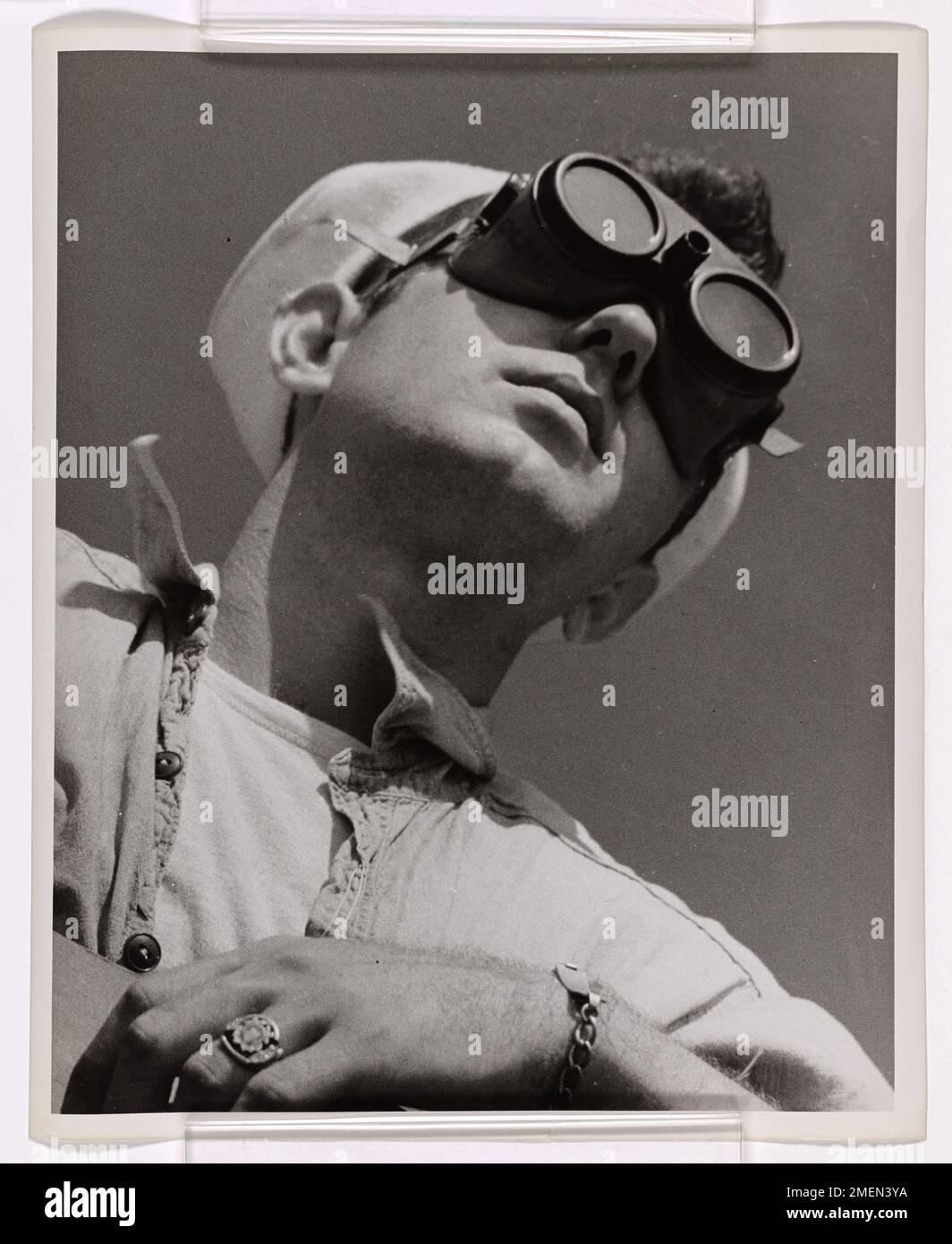 A Coast Guardsman watches the skies aboard an assault transport in the ...