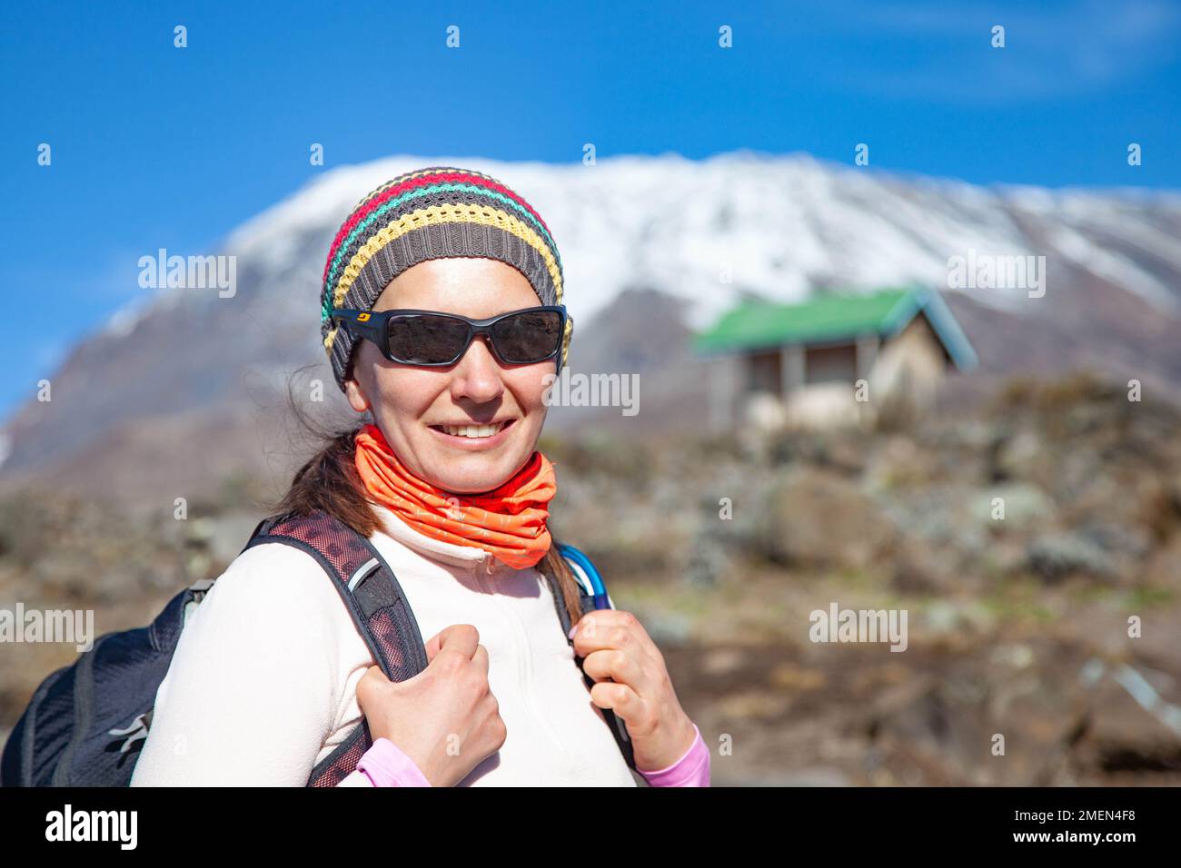Female backpacker on the trek to Kilimanjaro mountain Stock Photo - Alamy