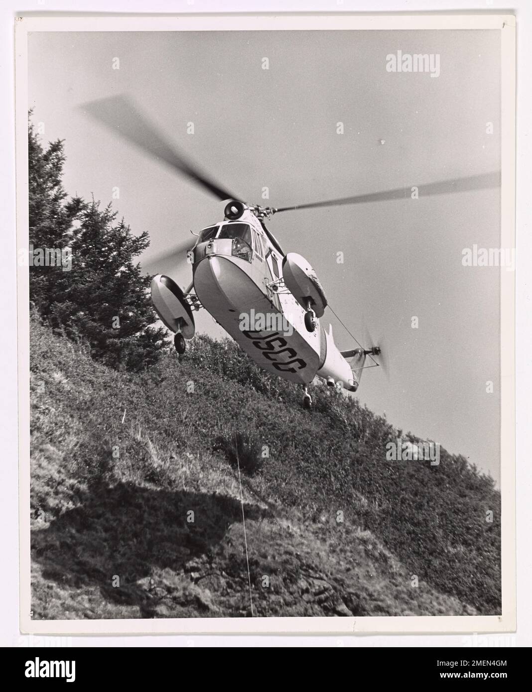 A Coast Guard helicopter performs a daring rescue operation to save ...