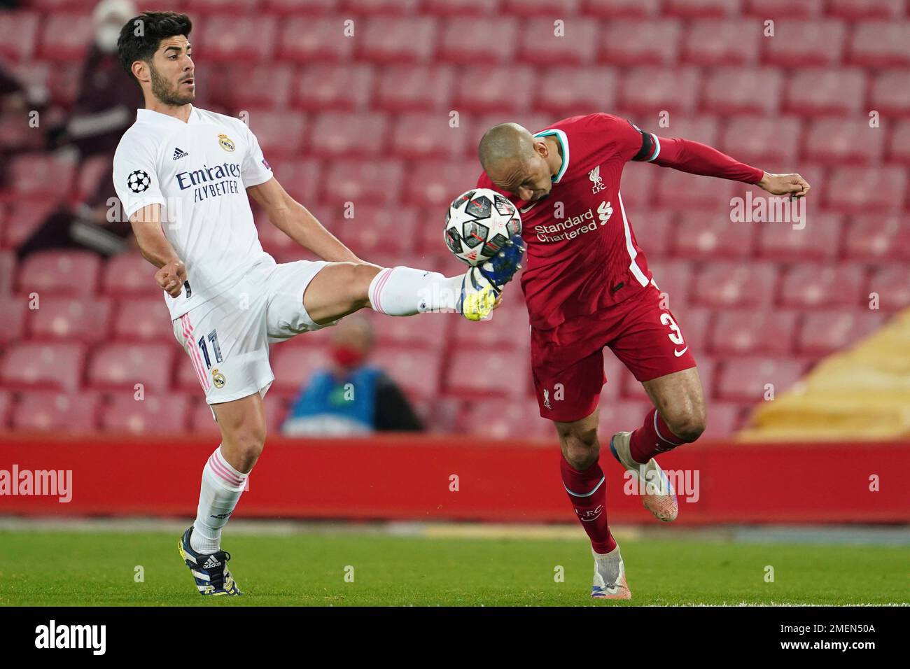 Real Madrid's Marco Asensio, fights for the ball with Liverpool's ...