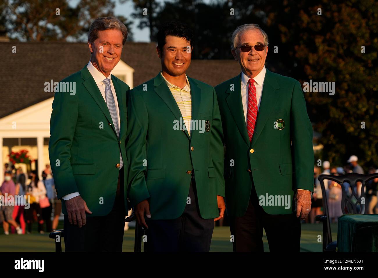 Hideki Matsuyama, of Japan, center, poses with Fred Ridley, chairman of ...