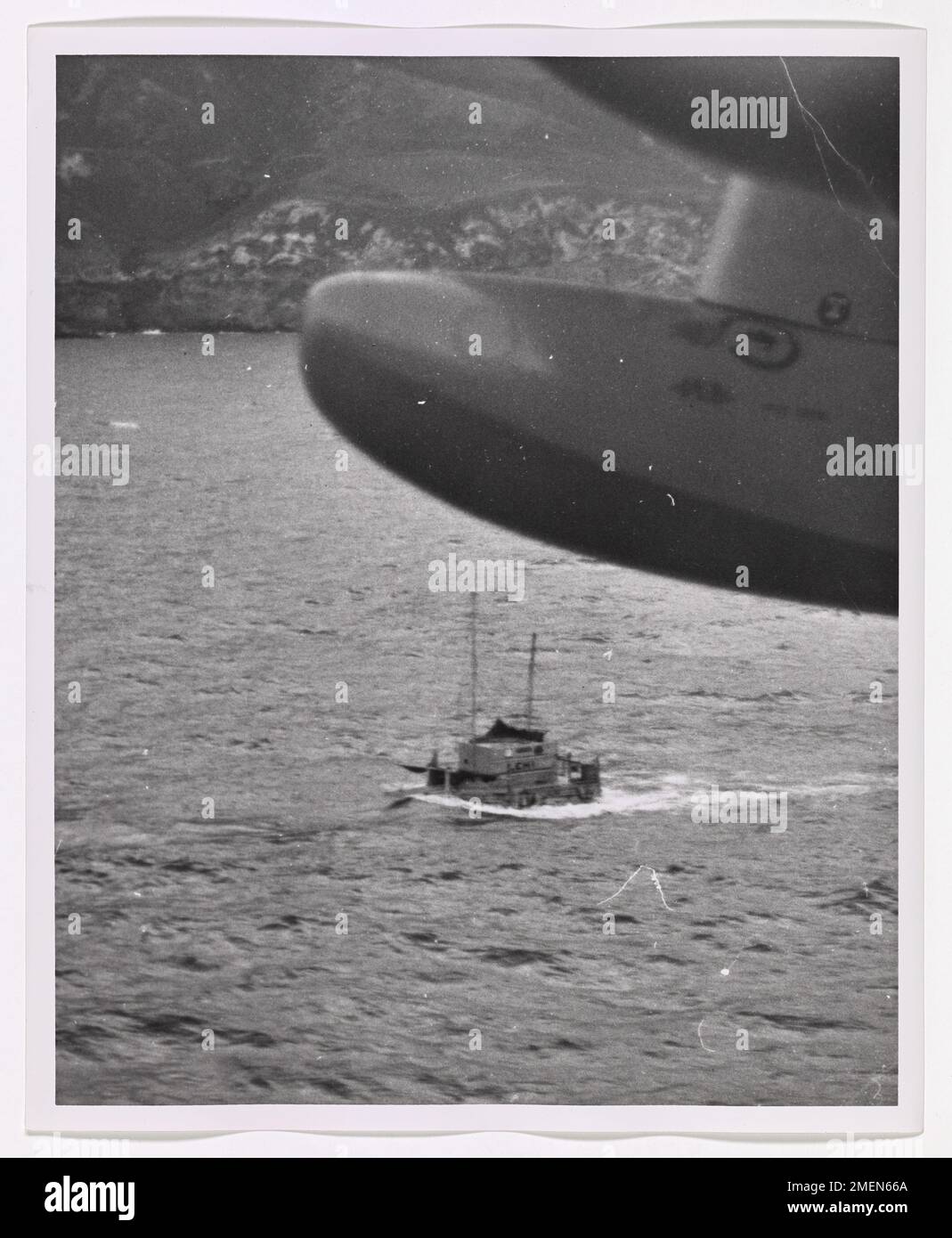 A Coast Guard plane assists the fishing vessel AMBERJACK in towing the ...