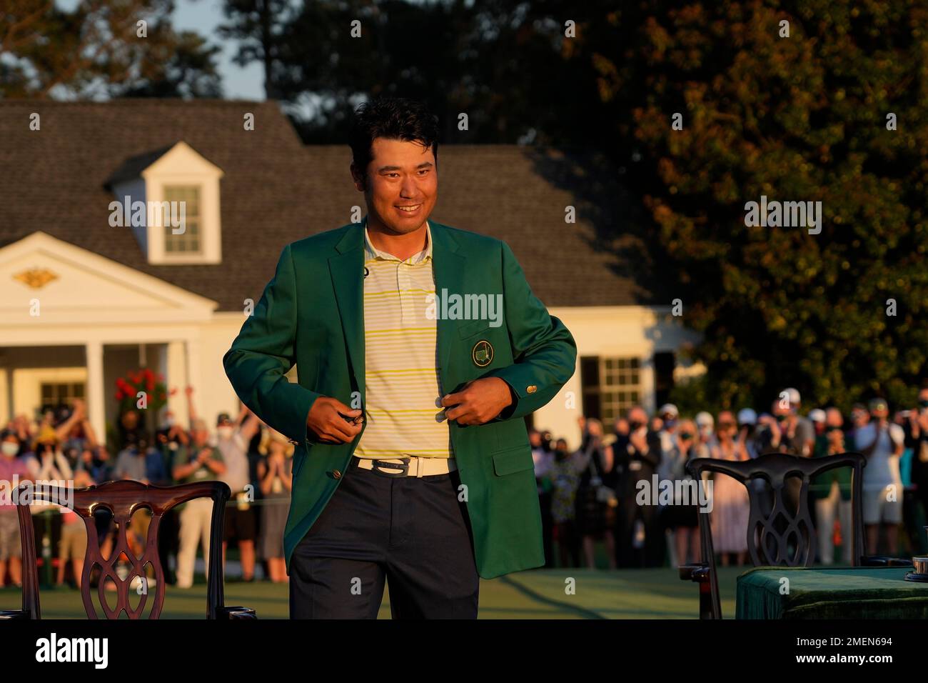 Hideki Matsuyama, of Japan, poses with his green jacket after winning ...