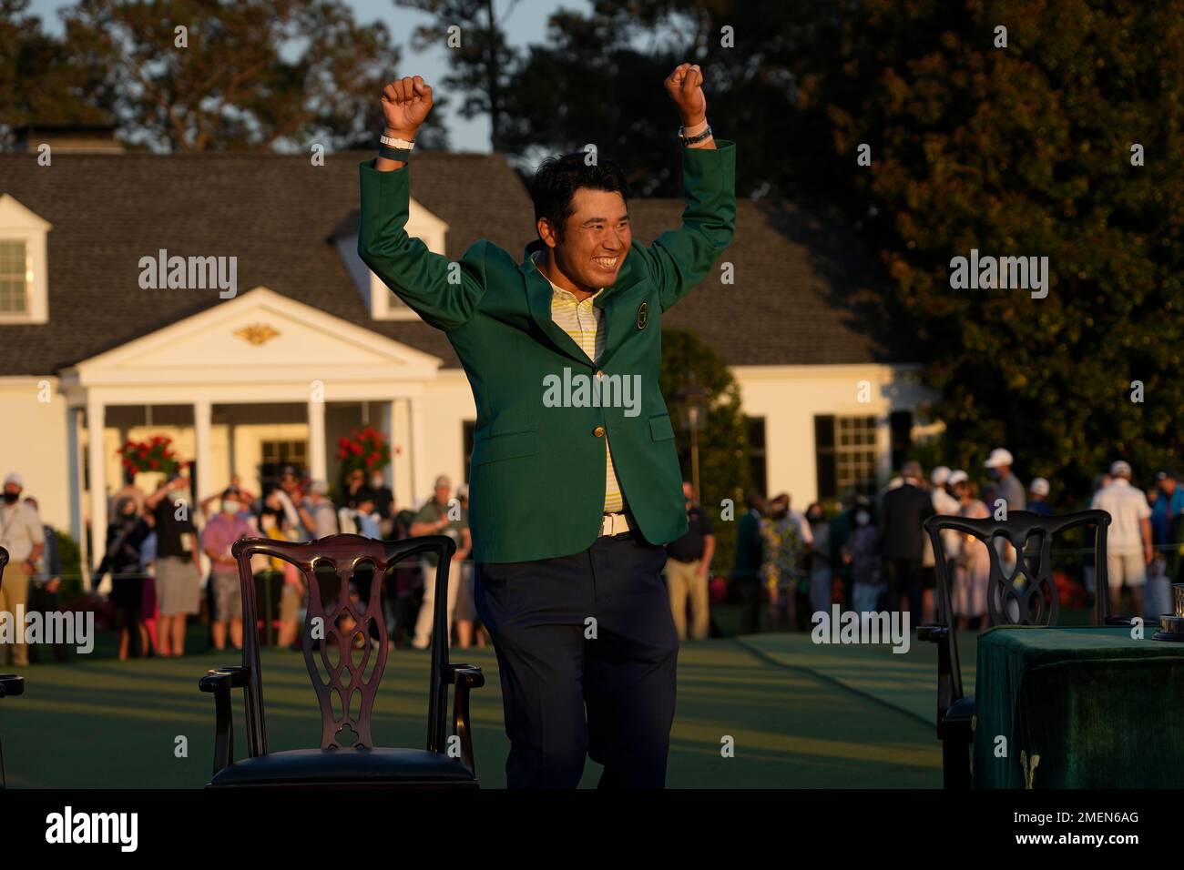 Hideki Matsuyama, of Japan, raises his arms after winning the Masters ...