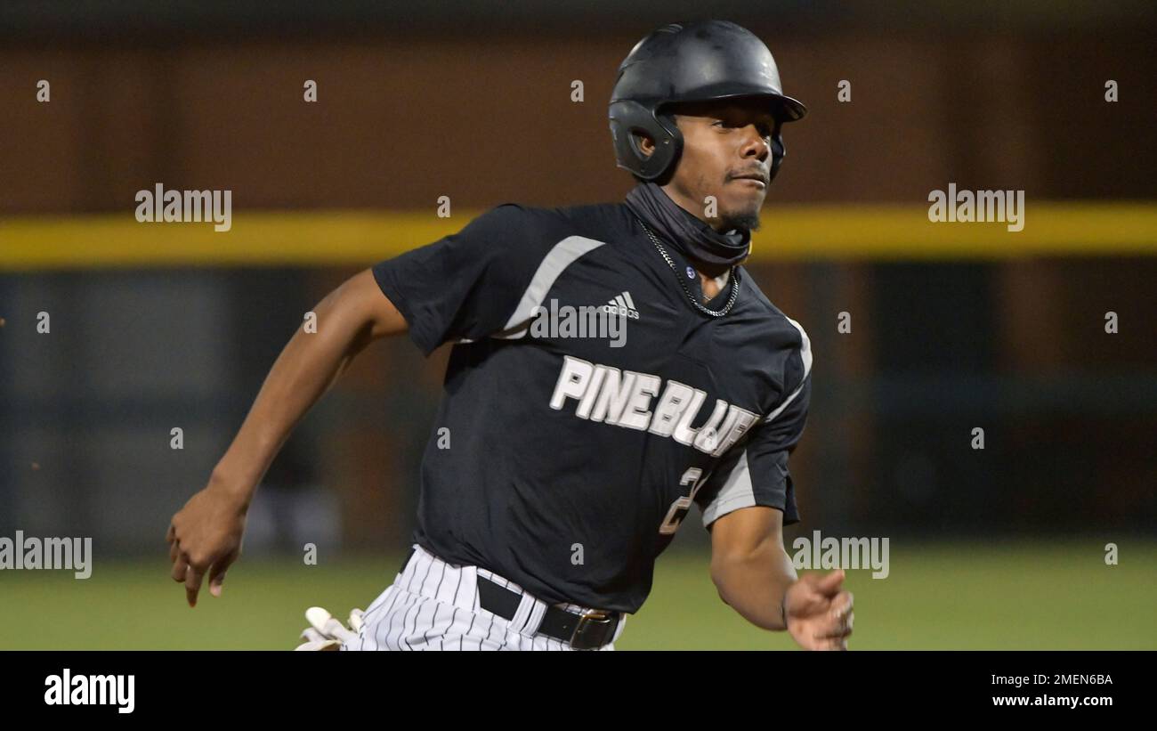 Pine Bluff baserunner Timothy Martin (26) rounds third base against ...