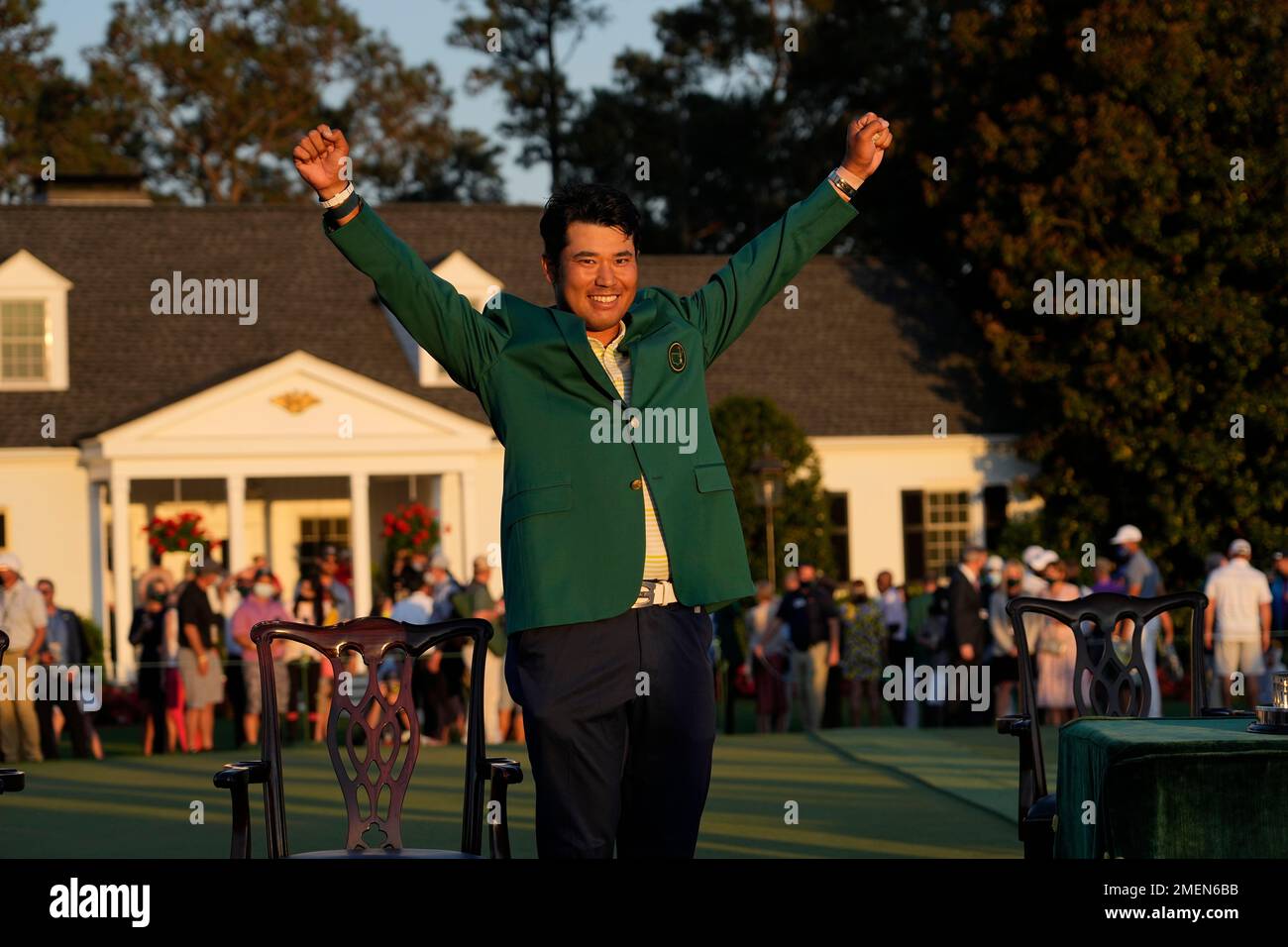 Hideki Matsuyama, of Japan, raises his arms after winning the Masters ...