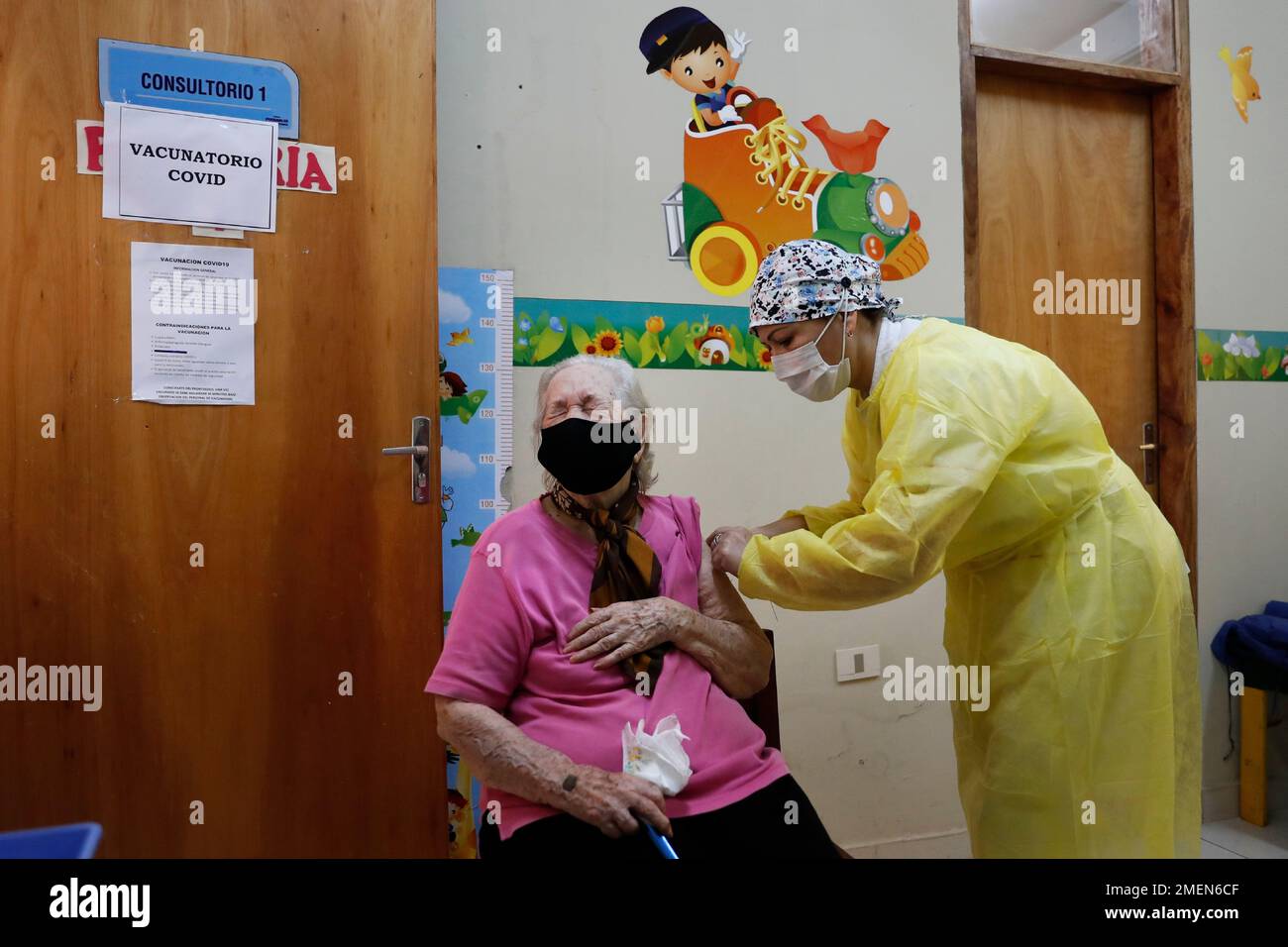 A woman gets a shot of India's COVAXIN vaccine for COVID-19 in the ...