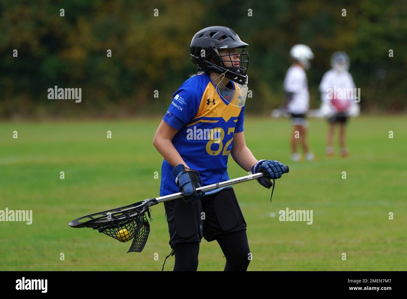 Female lacrosse goal keeper Stock Photo - Alamy
